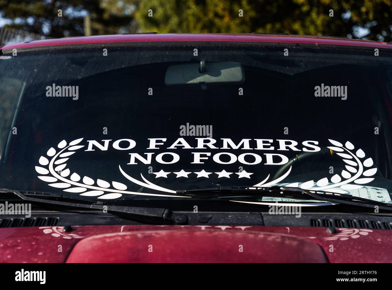 Signs and symbols, a car with a sticker on the windshield, with the ...