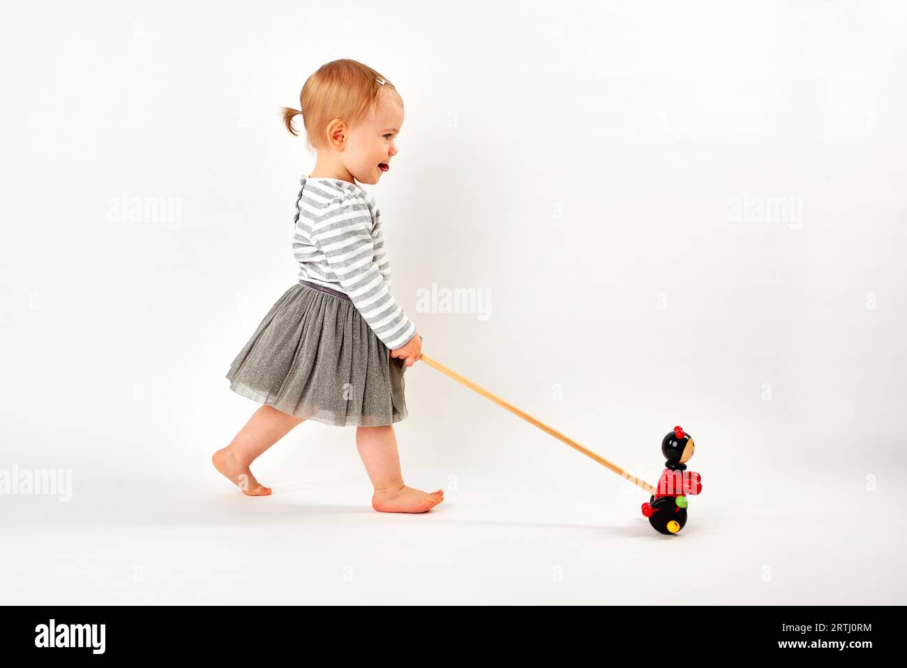 Child playing with ladybug Stock Photo - Alamy