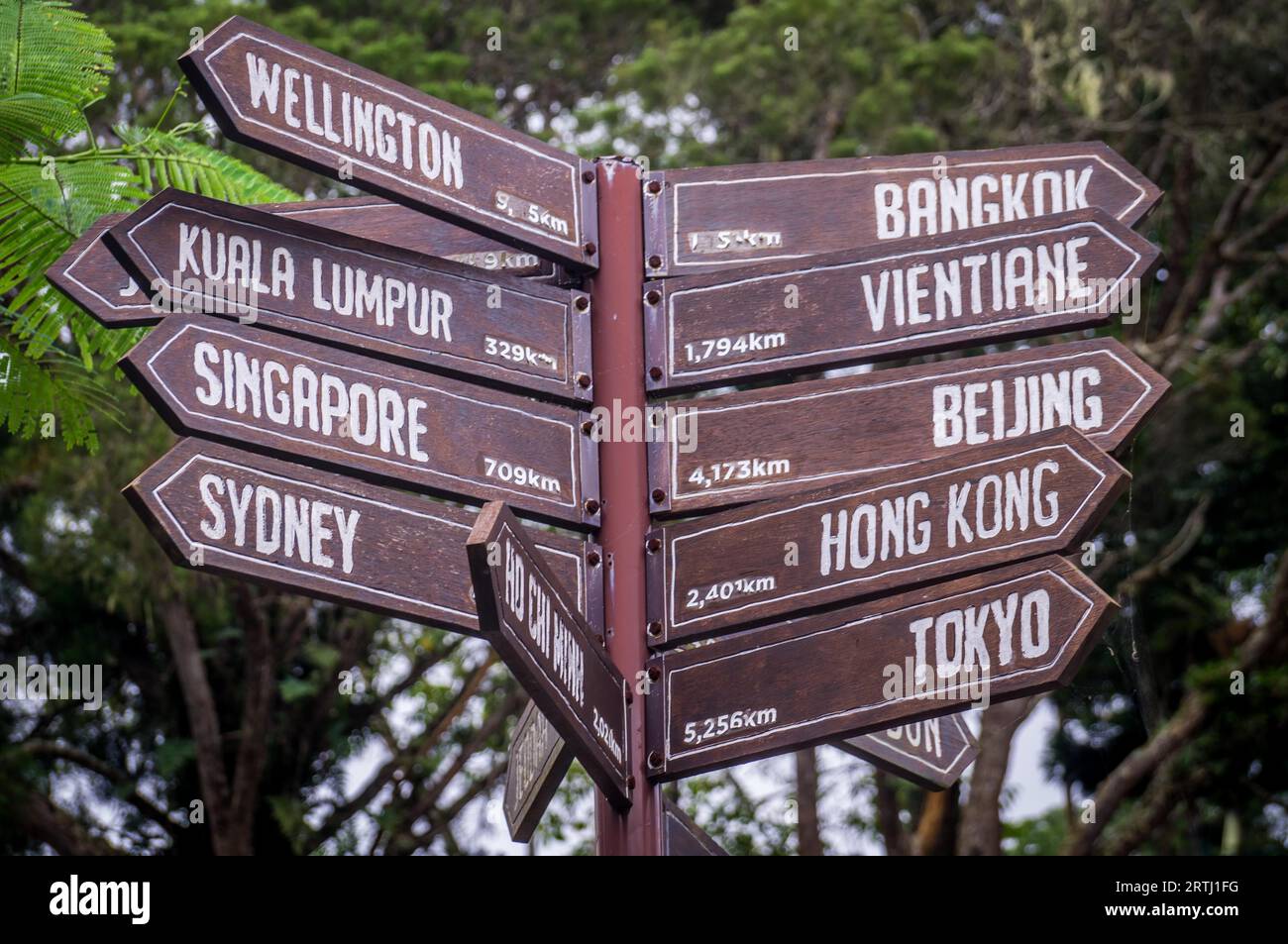Sign posts in Penang, Malaysia pointing towards cities in Asia ...
