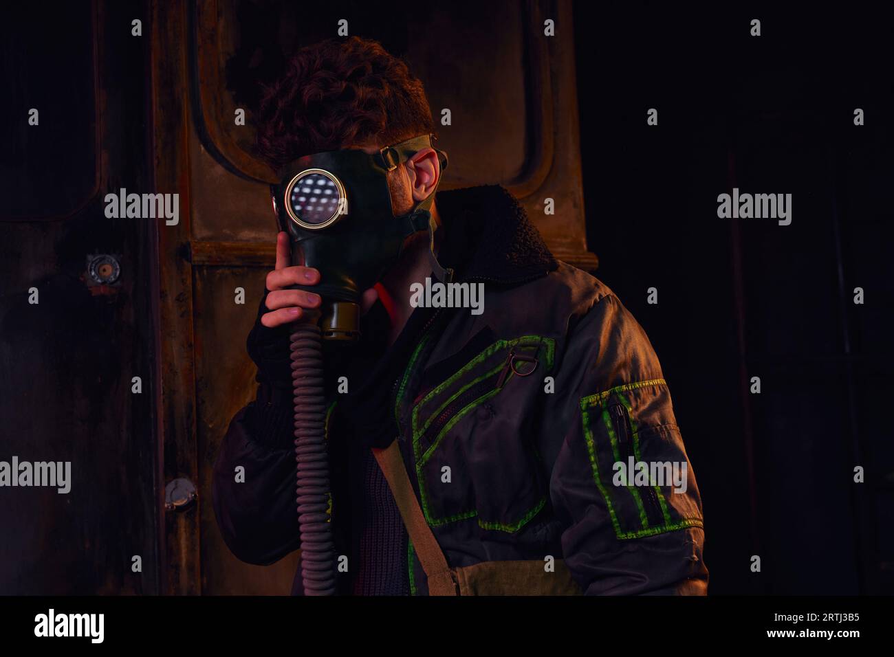 man wearing gas mask in toxic environment of underground tunnel ...