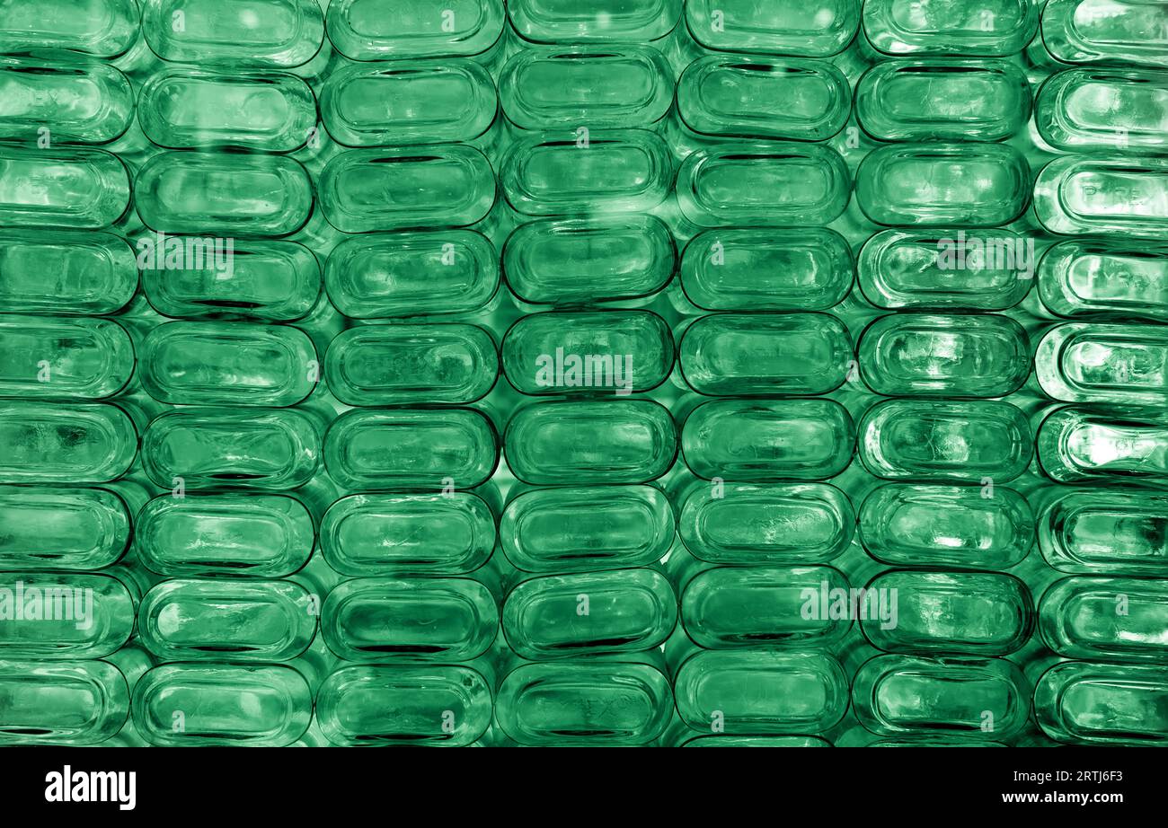 Large group of empty green color recycled glass bottles Stock Photo - Alamy