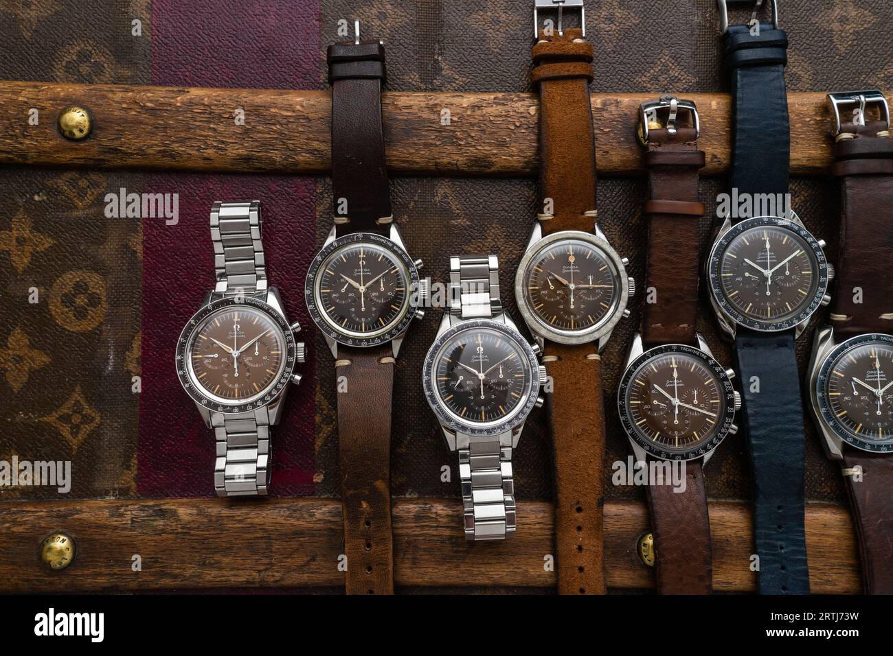Vintage Omega Speedmaster shoot on top of an old riveted Louis Vuitton ...