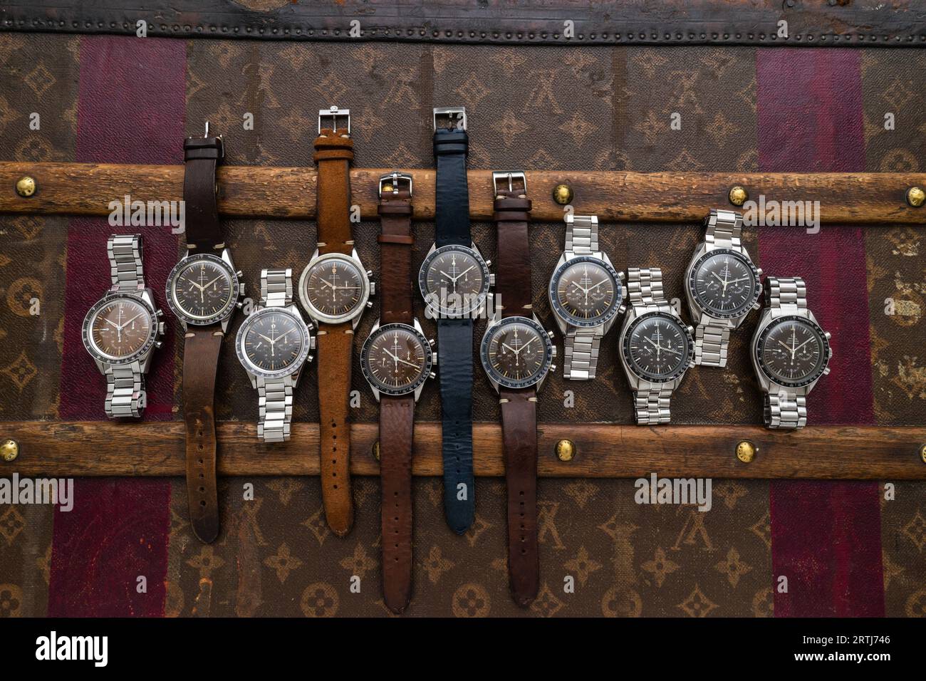 Vintage Omega Speedmaster shoot on top of an old riveted Louis Vuitton ...