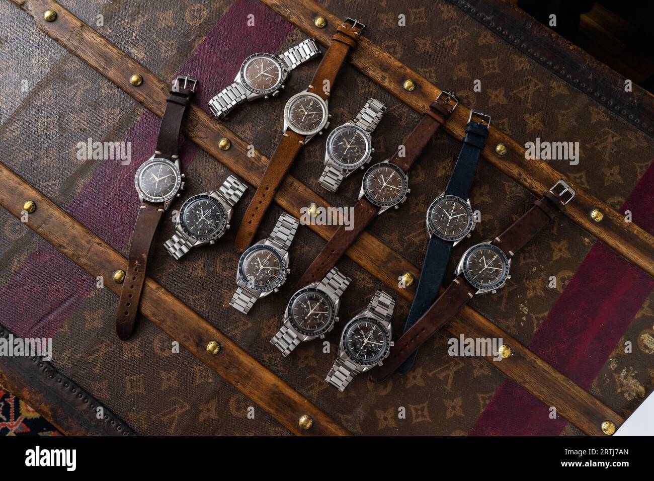 Vintage Omega Speedmaster shoot on top of an old riveted Louis Vuitton ...