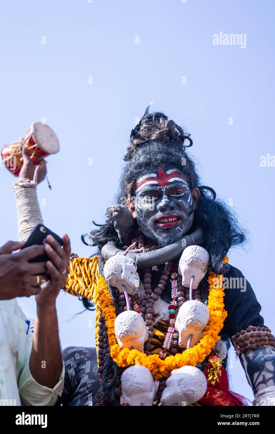 Masan Holi, Portrait of an male artist with painted face act as lord ...
