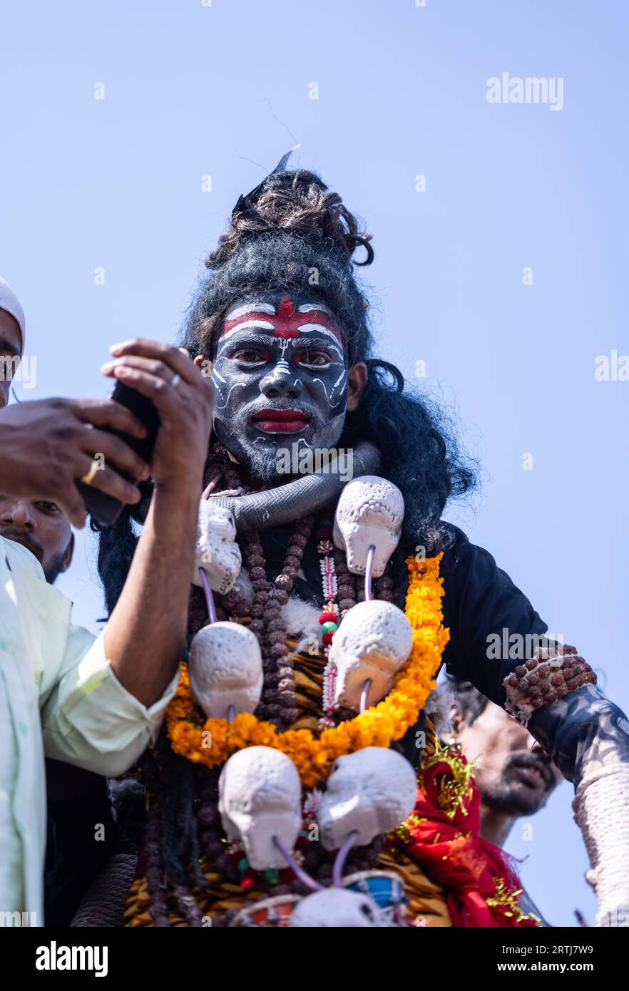 Masan Holi, Portrait of an male artist with painted face act as lord ...