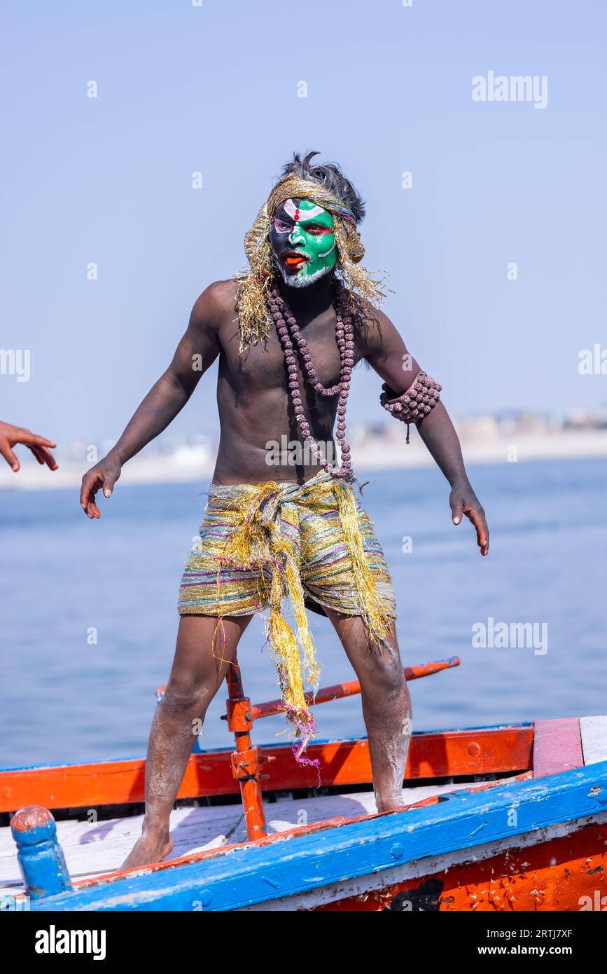 Masan Holi, Portrait of an male artist with painted face act as lord ...
