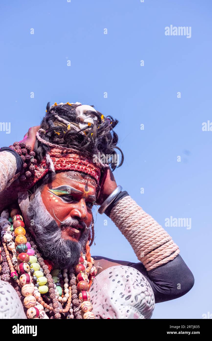 Masan Holi, Portrait of an male artist with painted face act as lord ...