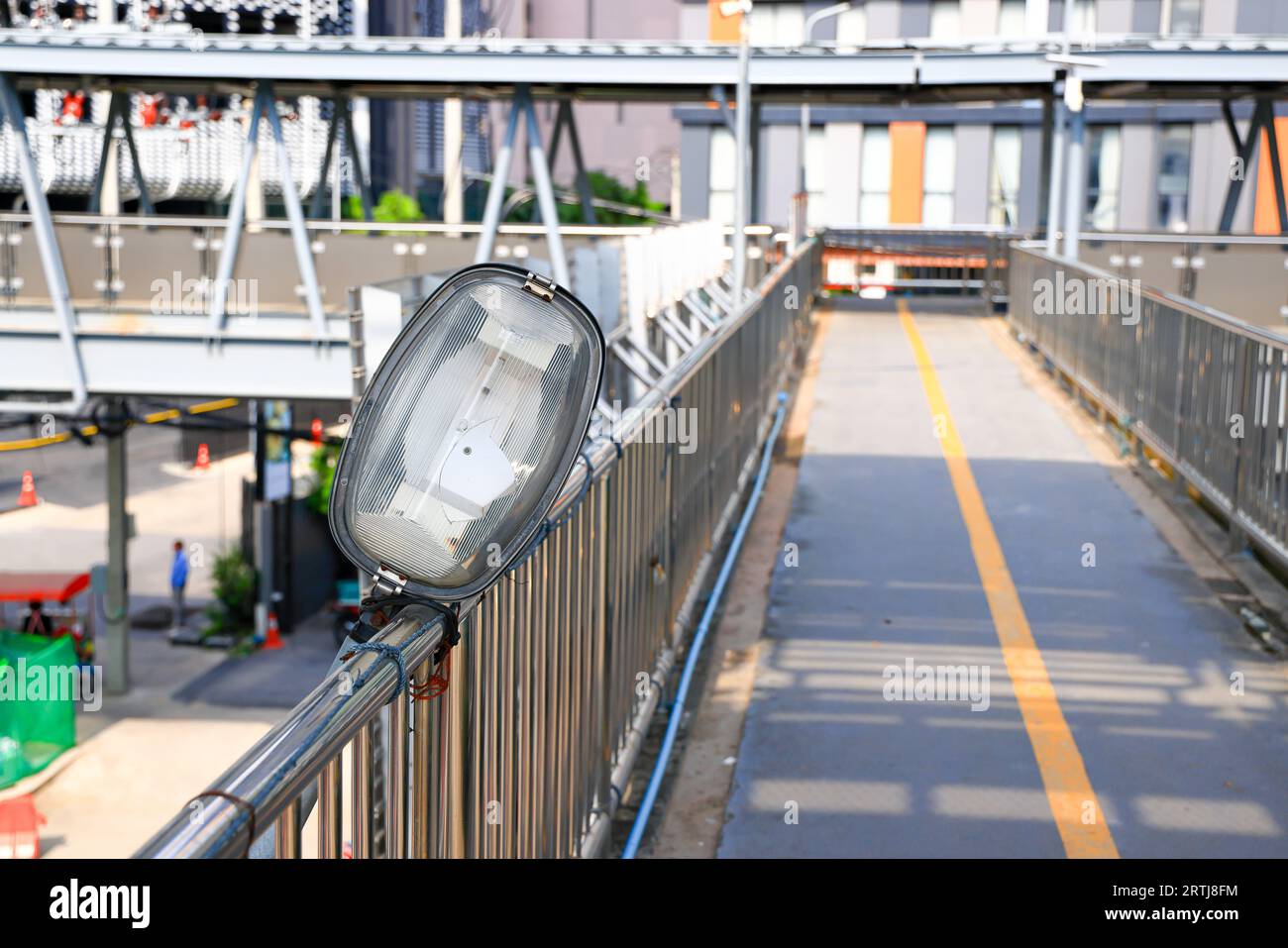 A broken street lamp lying on the pedestrian walkway Stock Photo - Alamy