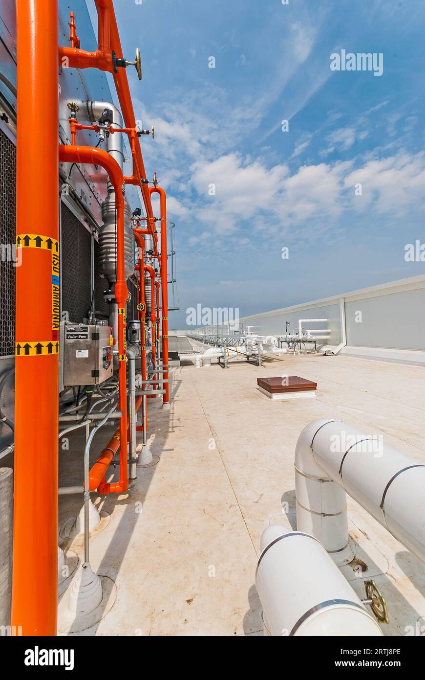 Orange piping is prominent on the side of a commercial ammonia-cycle ...