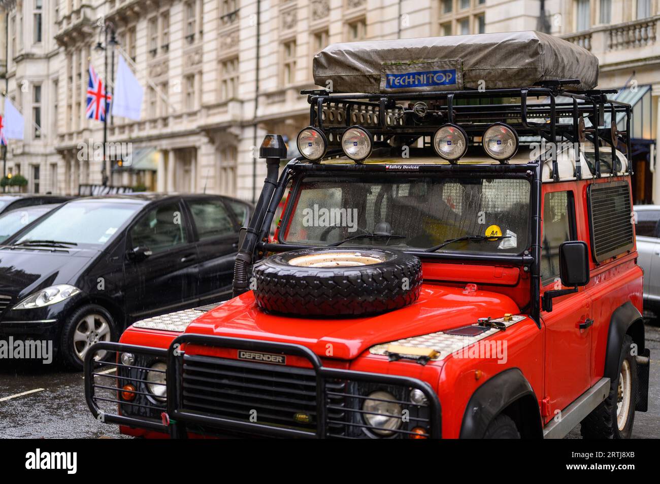 LONDON - April 24, 2023: A red off-road Land Rover, loaded for ...