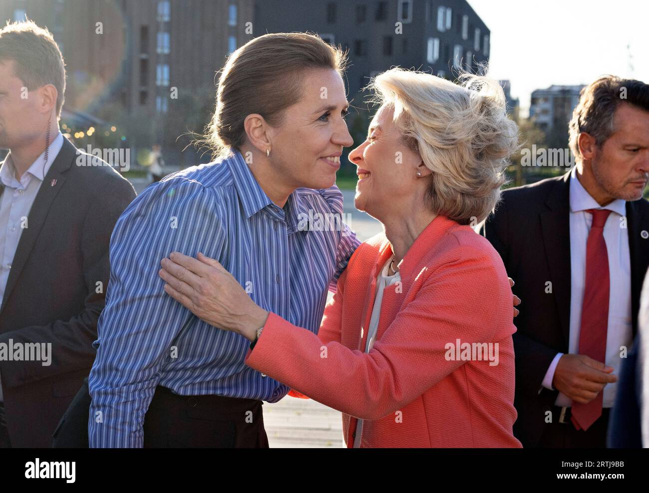 Danish Prime Minister Mette Frederiksen, left, greets EU Commission ...