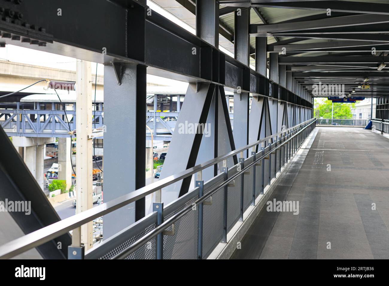 Pedestrian pathway or corridor or hallway between train station and ...
