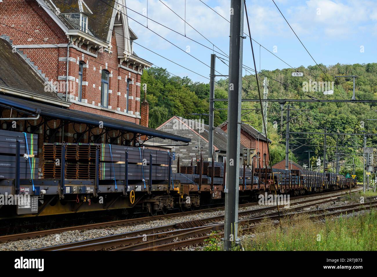 Moving freight train with carriage loaded with metal powder in the ...