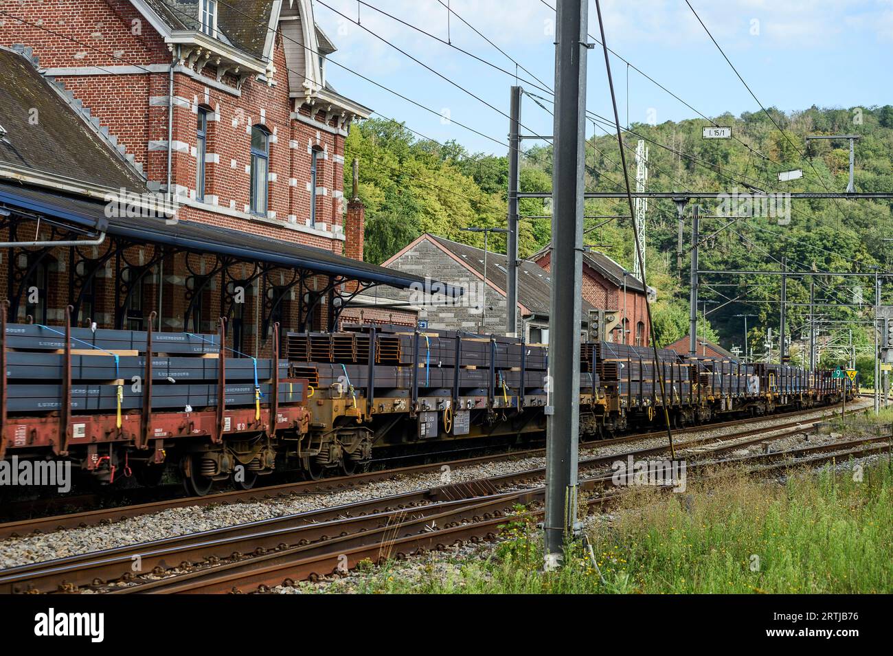 Moving freight train with carriage loaded with metal powder in the ...