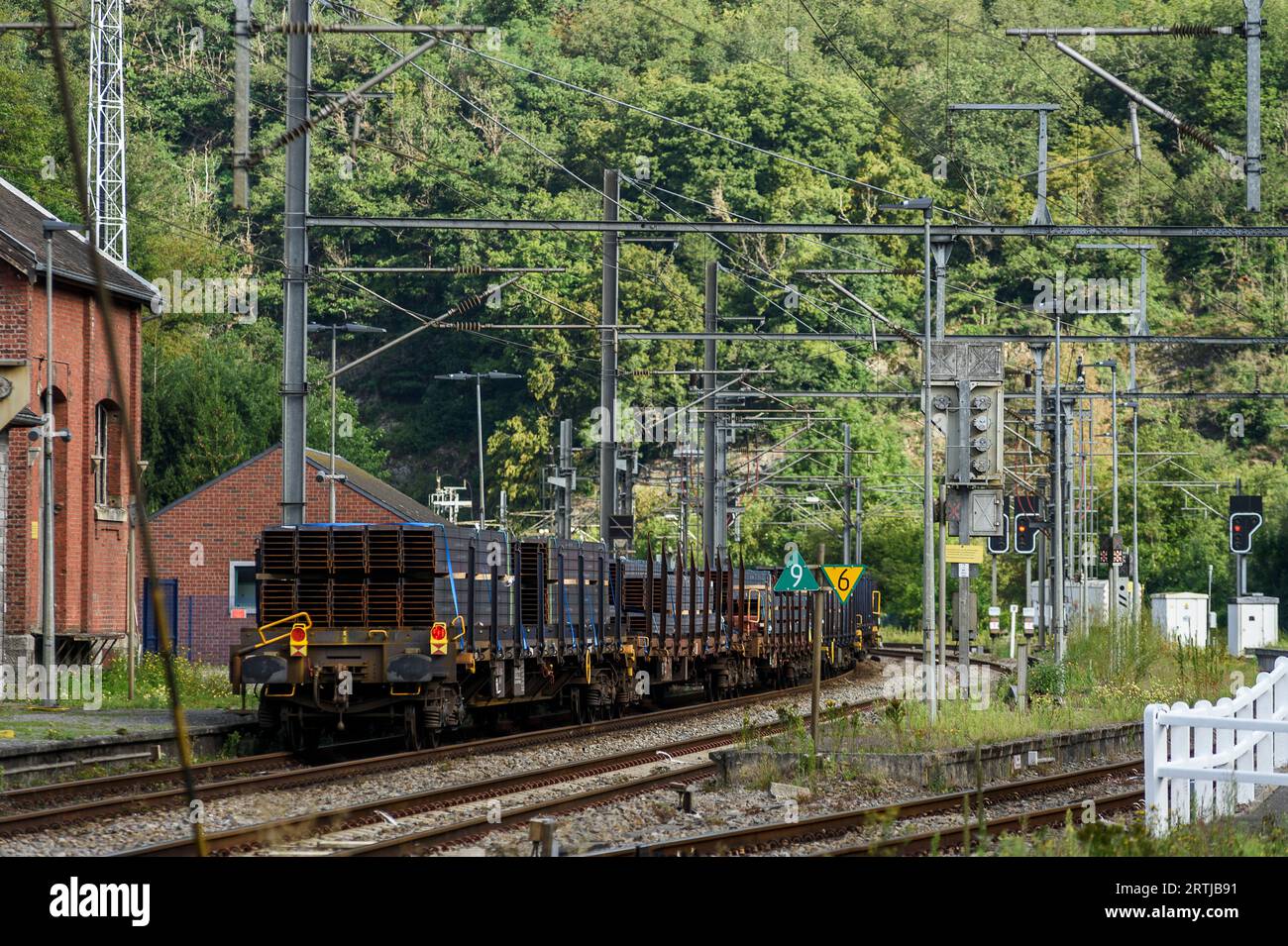 Moving freight train with carriage loaded with metal powder in the ...