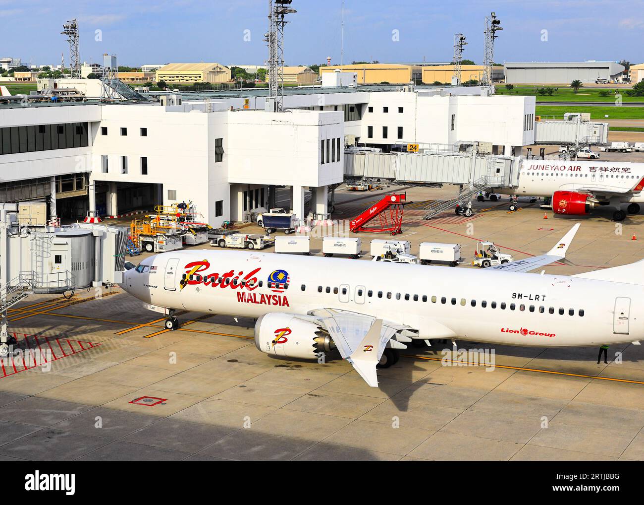 Don-Mueang Airport view, The red-white Airplane parking at passenger ...