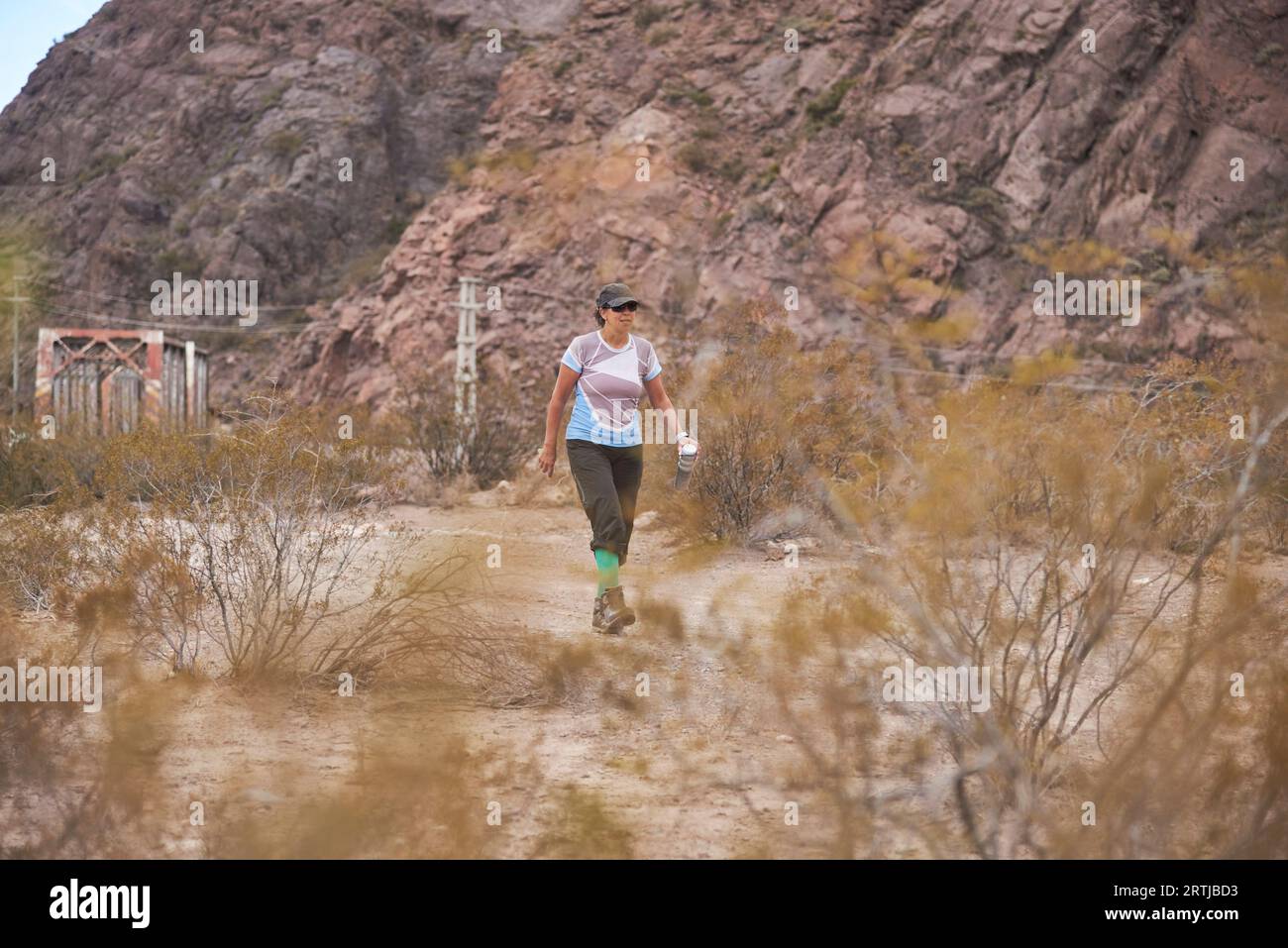 Latin woman walking in a rugged environment in Potrerillos, Mendoza ...