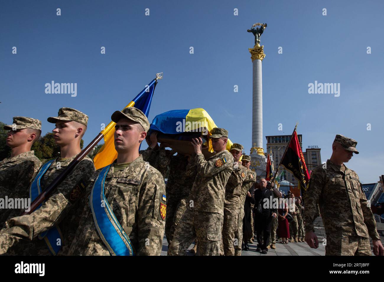 Honor guard soldiers carry the coffin with the body of deceased Sergii ...