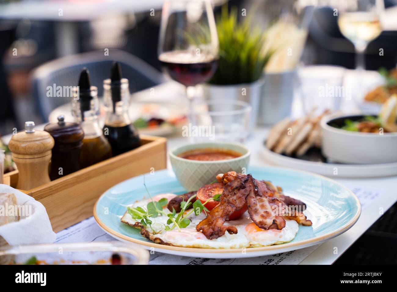 English Breakfast with fried eggs, bacon, Hungarian sausage, mushrooms ...