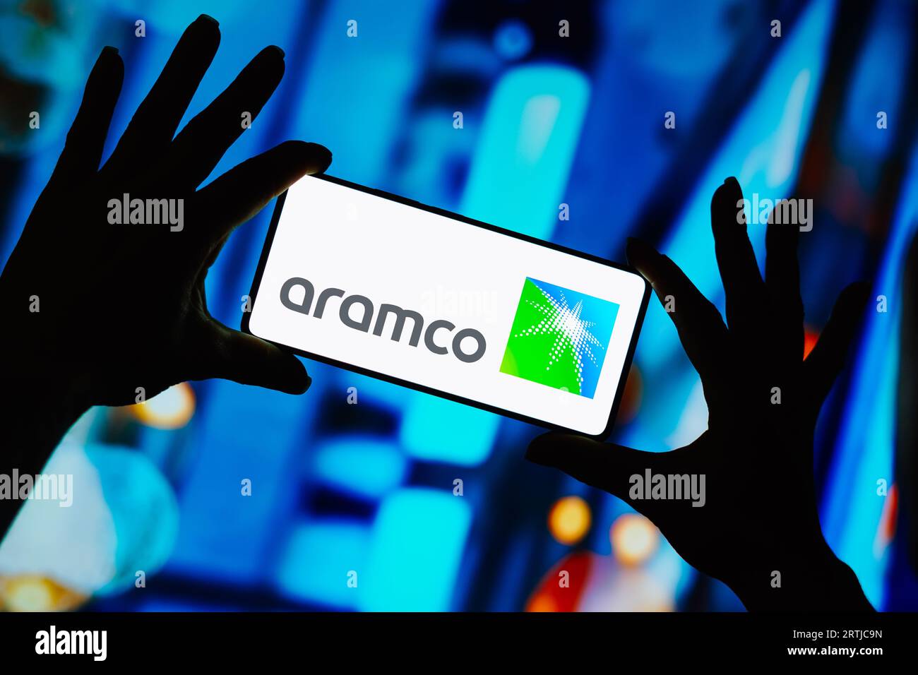 In this photo illustration, the Saudi Aramco logo is displayed on a ...
