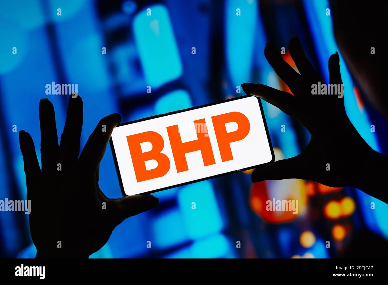 In this photo illustration, the BHP Billiton logo is displayed on a ...
