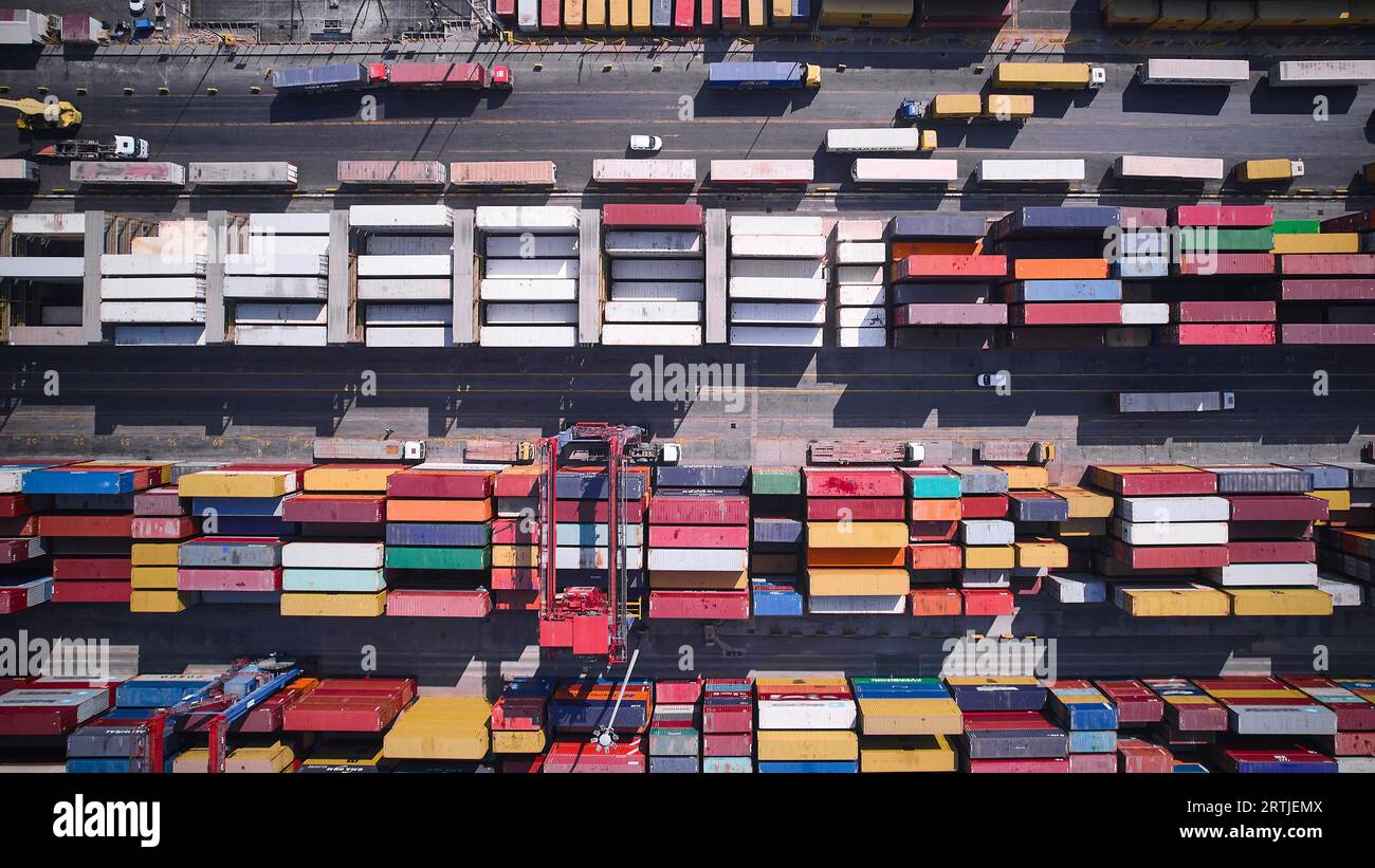 Stacked cargo containers top down aerial view. Containers at logistics ...