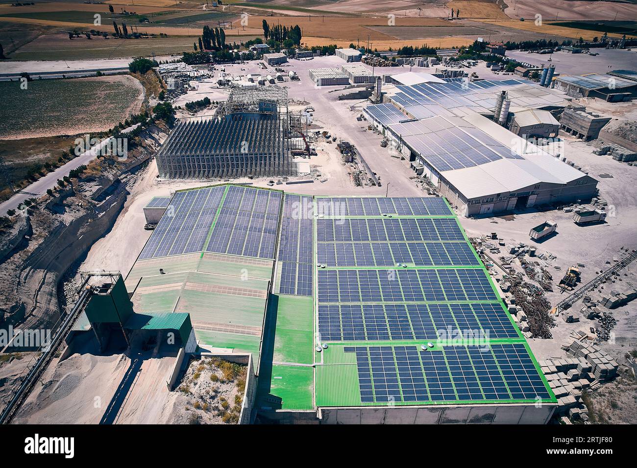 Aerial view of industrial buildings with photovoltaic panels installed ...