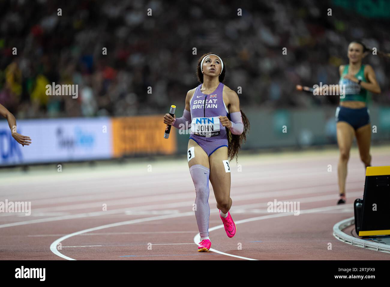 Yemi Mary John participating in the 4X400 meters relay at the World ...