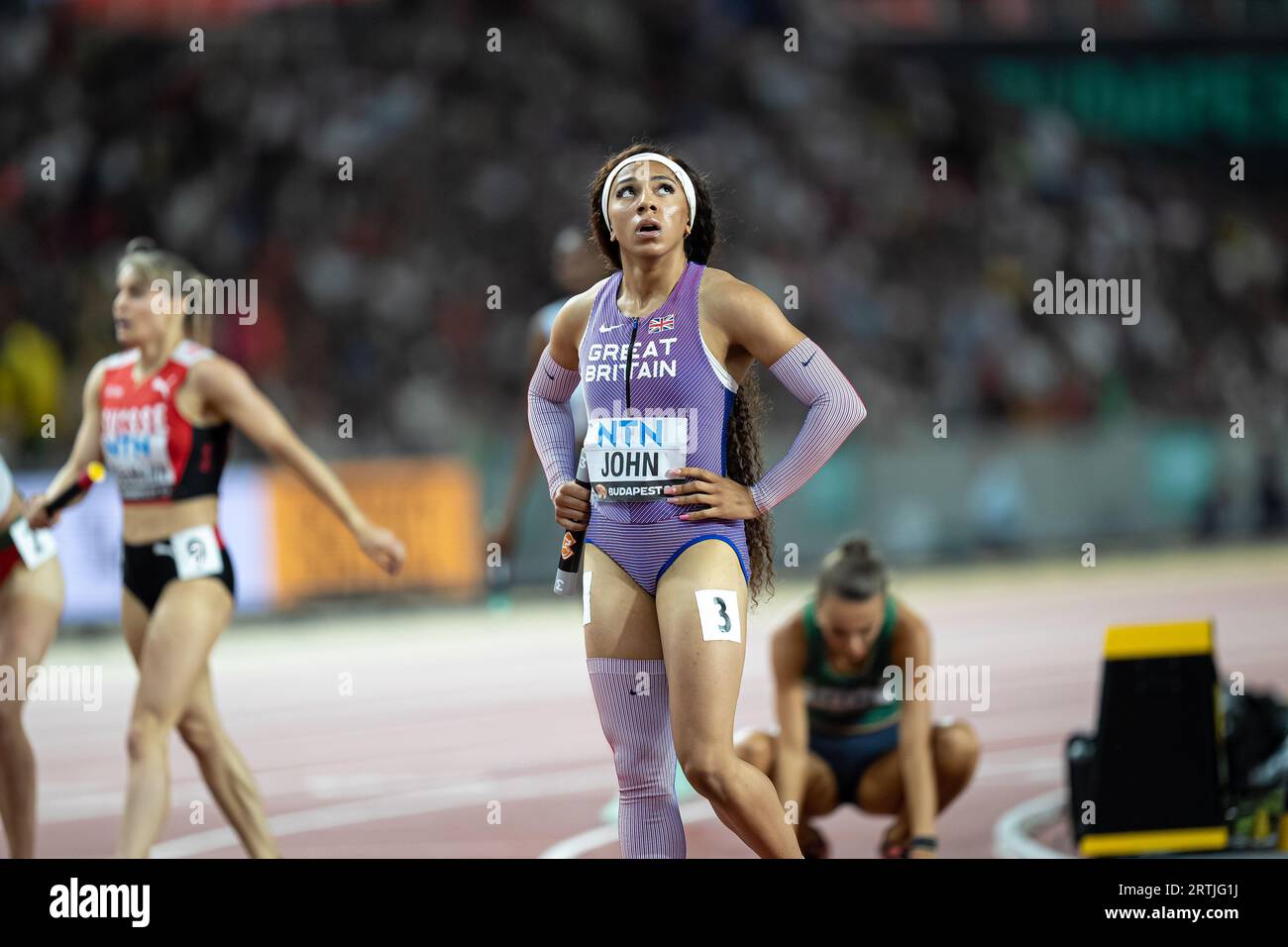 Yemi Mary John participating in the 4X400 meters relay at the World ...