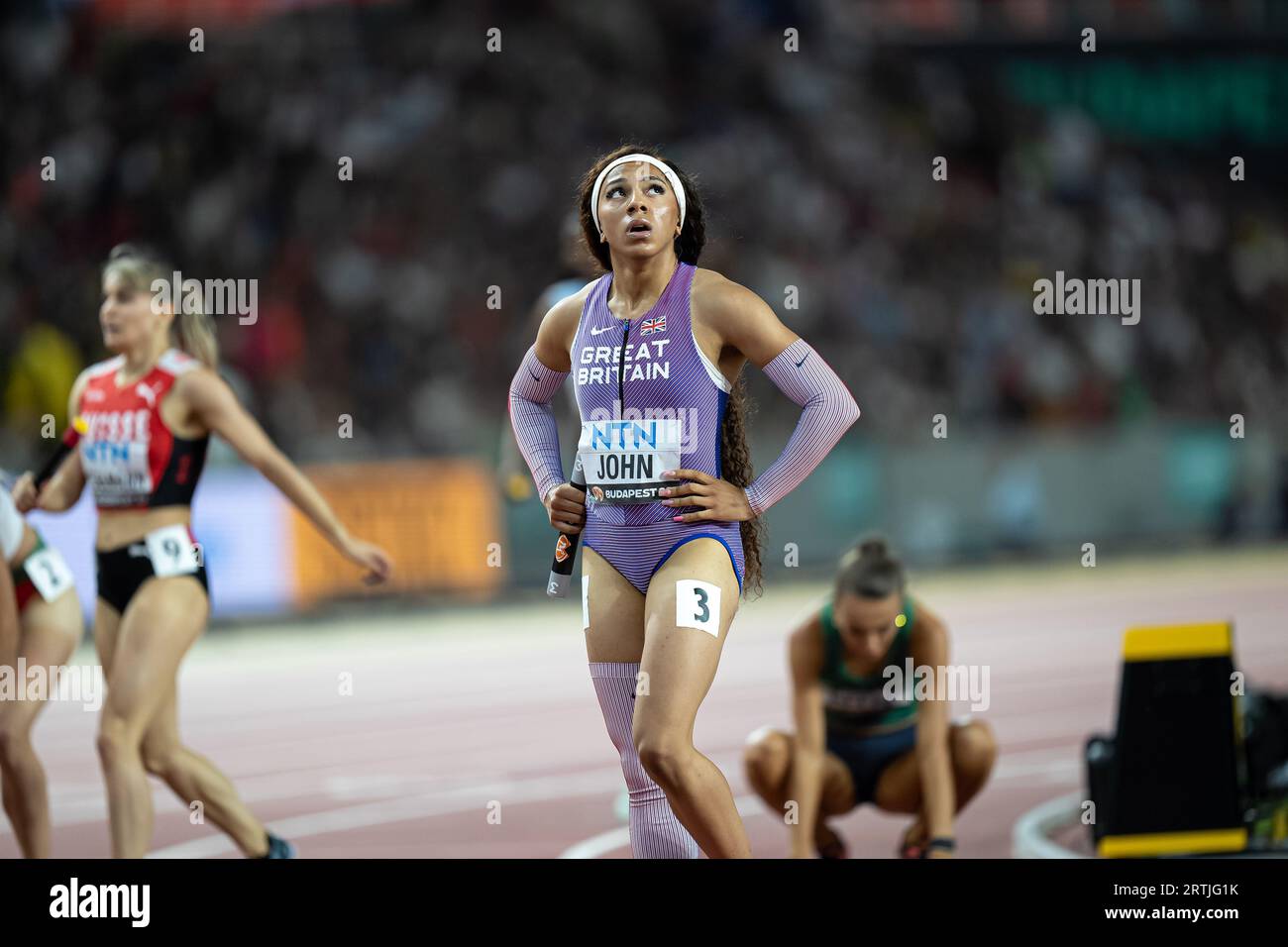 Yemi Mary John participating in the 4X400 meters relay at the World ...