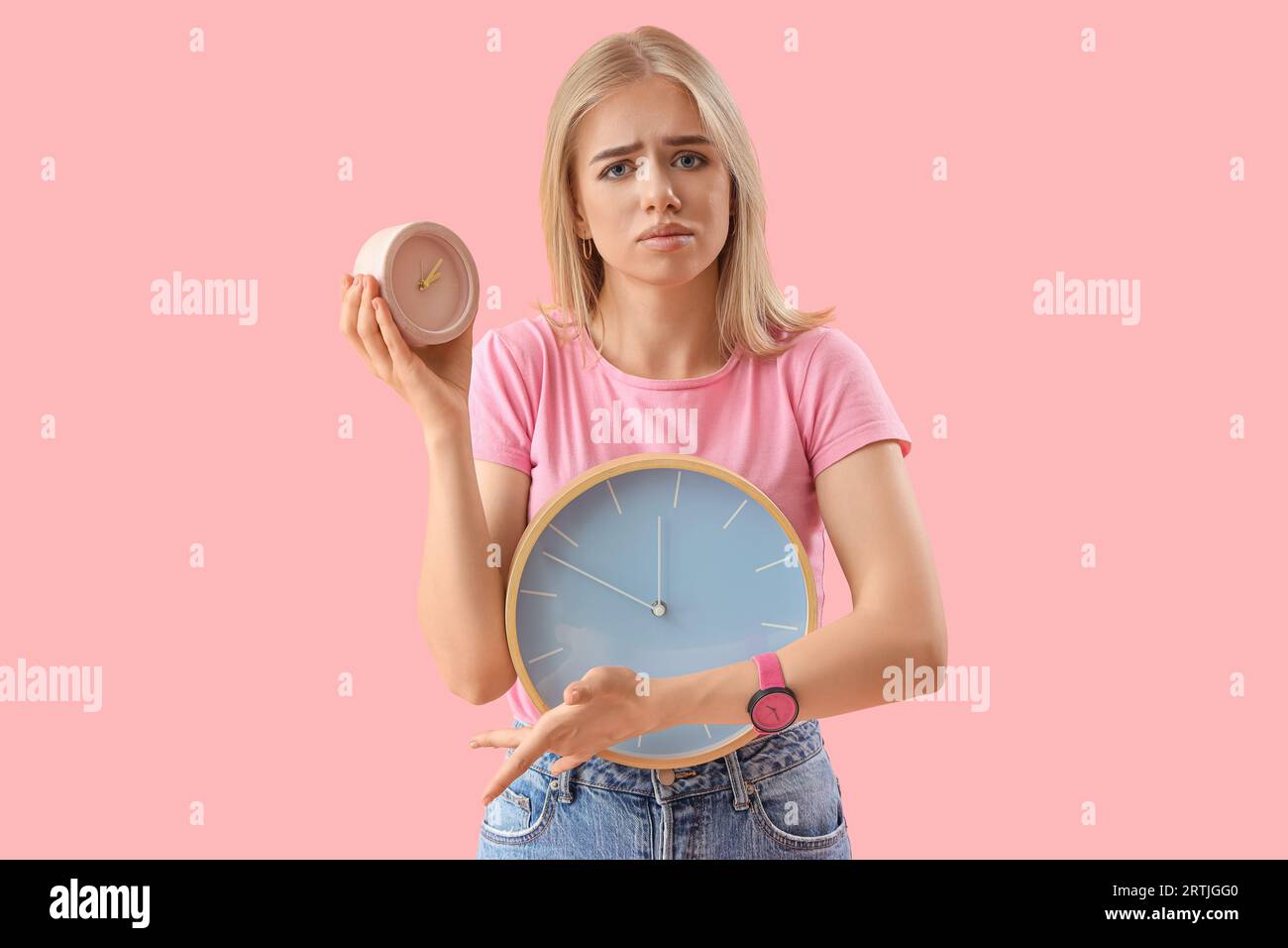 Stressed young woman clocks hi-res stock photography and images - Alamy