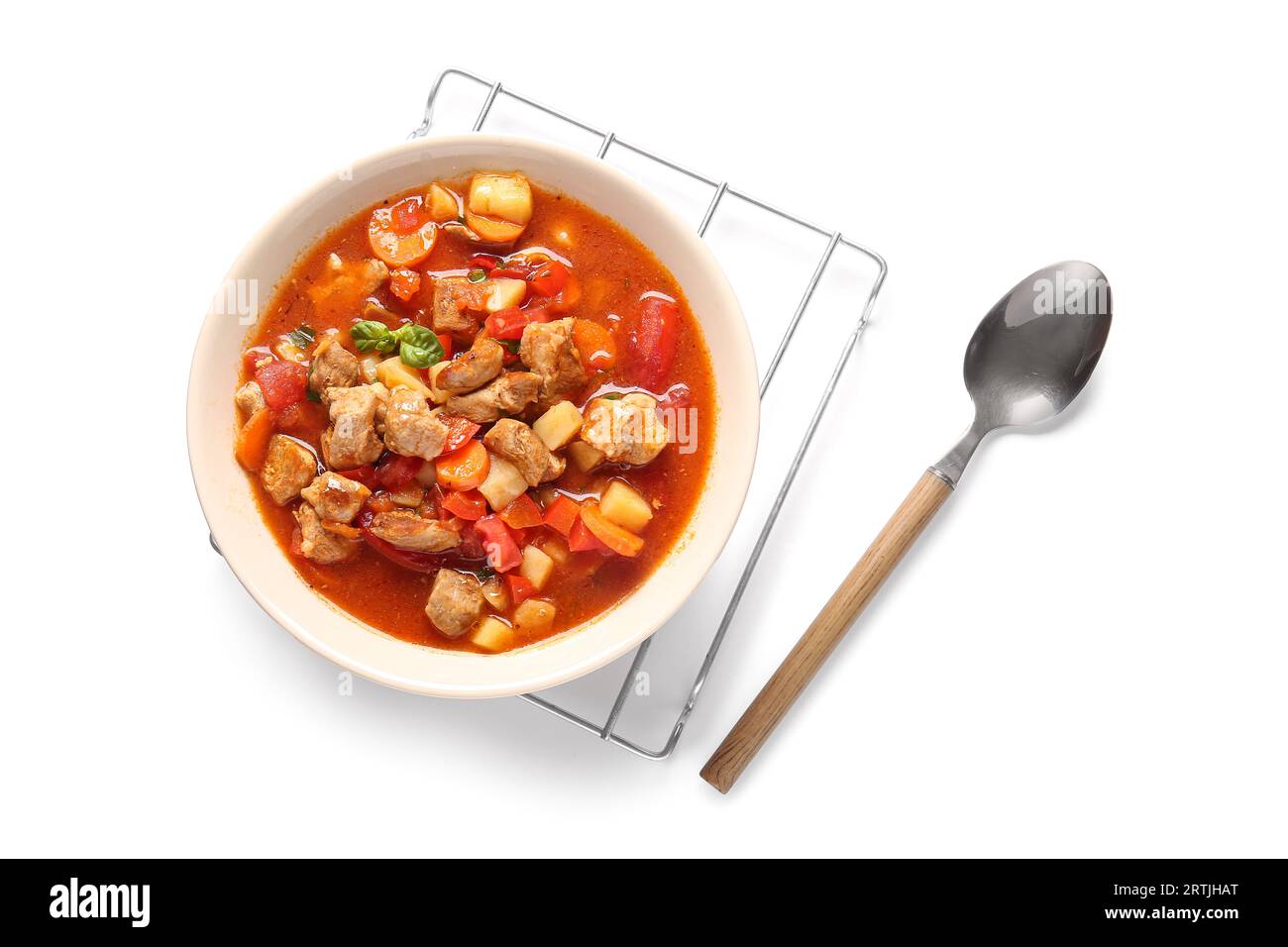 Bowl of tasty beef stew on white background Stock Photo - Alamy