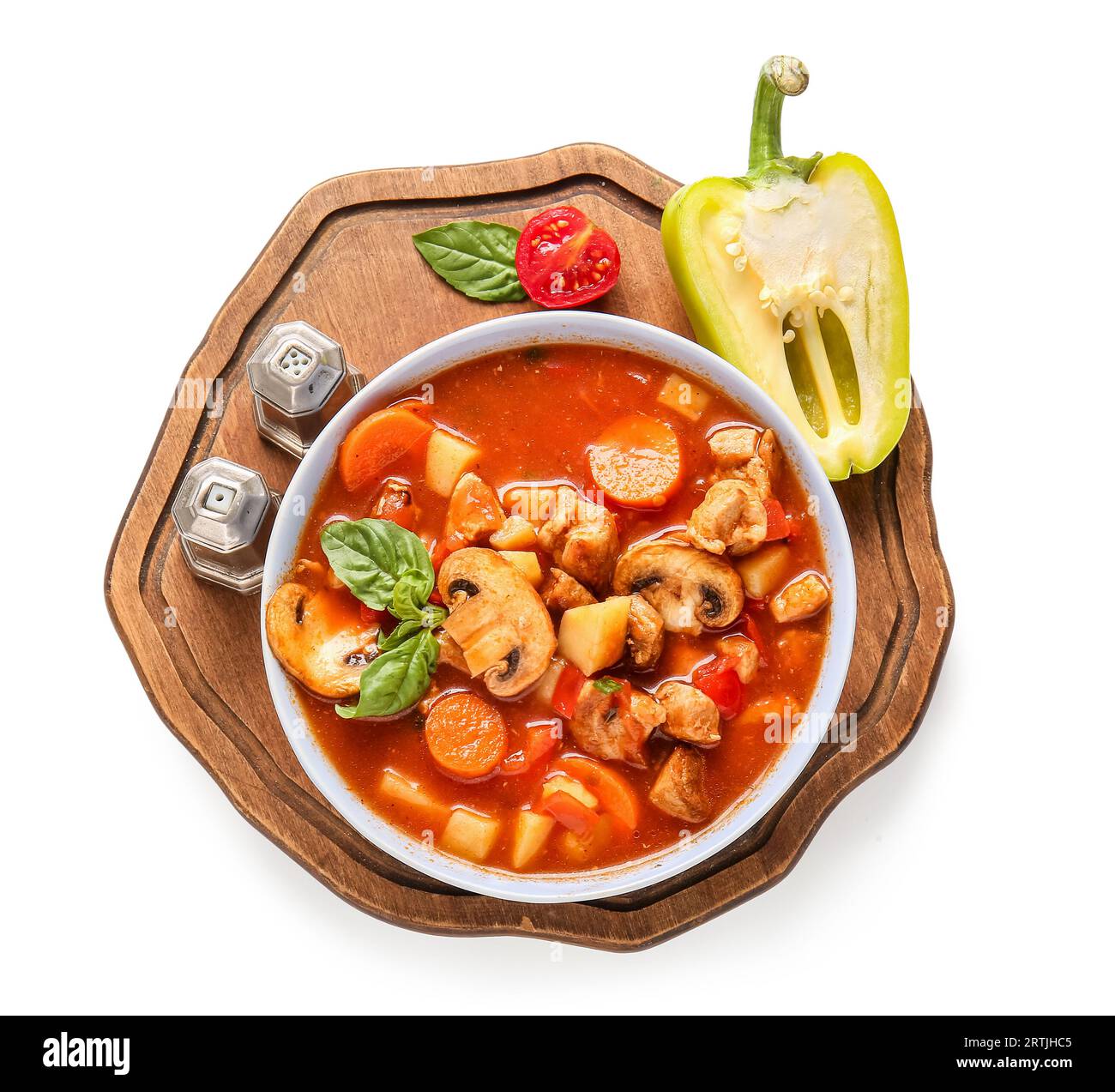 Bowl of tasty beef stew with tomato, bell pepper and spices on white ...
