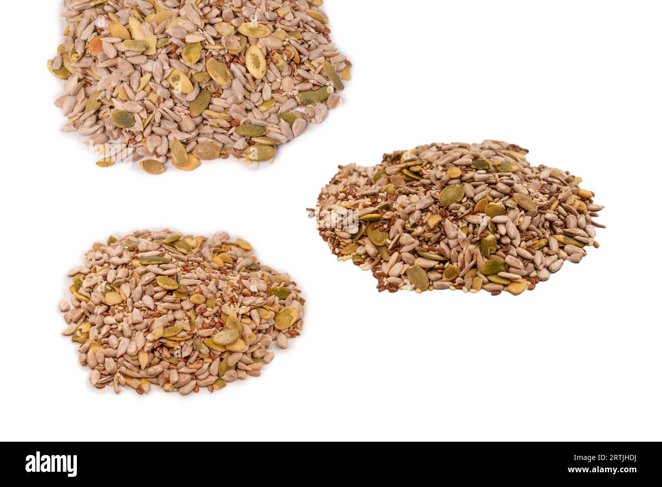 Mix of seeds for a salad. A pile of mixed seeds isolated on a white ...