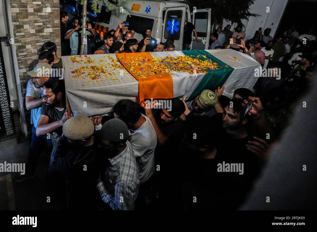 Relatives and colleagues carry the coffin of Indian police officer ...