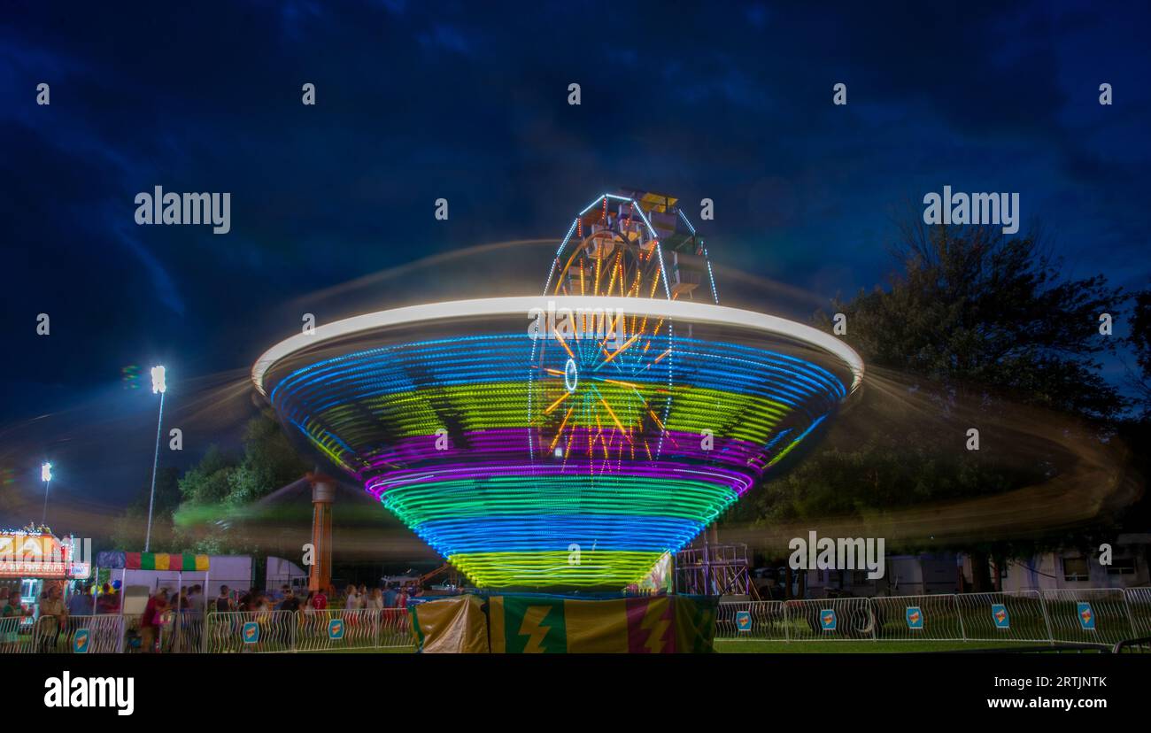 Festive rides at the county fair at night. Photo by Liz Roll Stock ...
