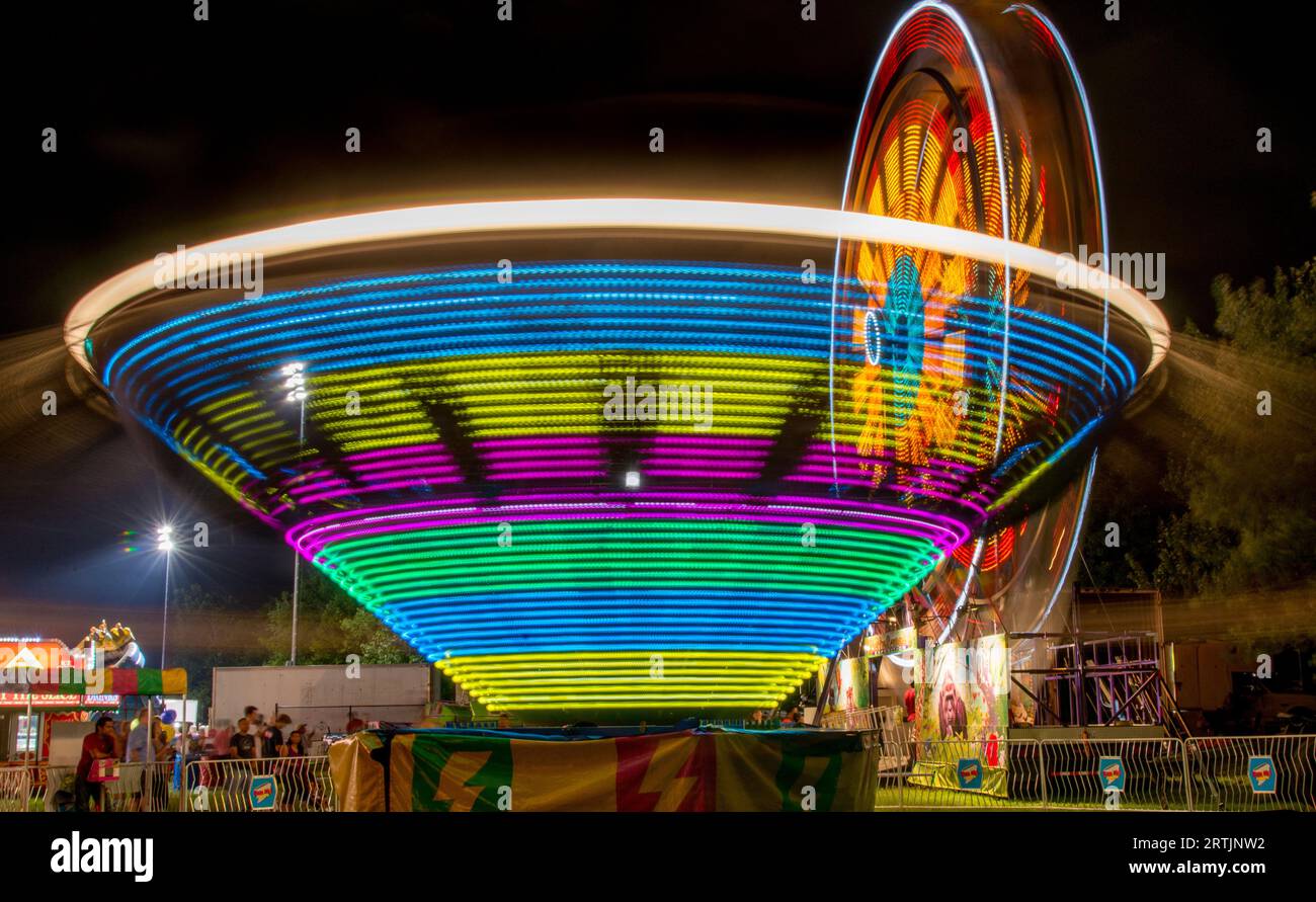 Festive rides at the county fair at night. Photo by Liz Roll Stock ...