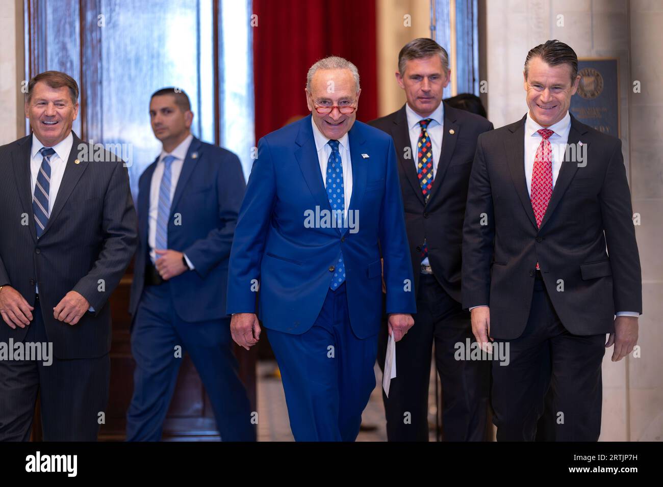 Senate Majority Leader Chuck Schumer, D, N.Y., center, walks with, from ...