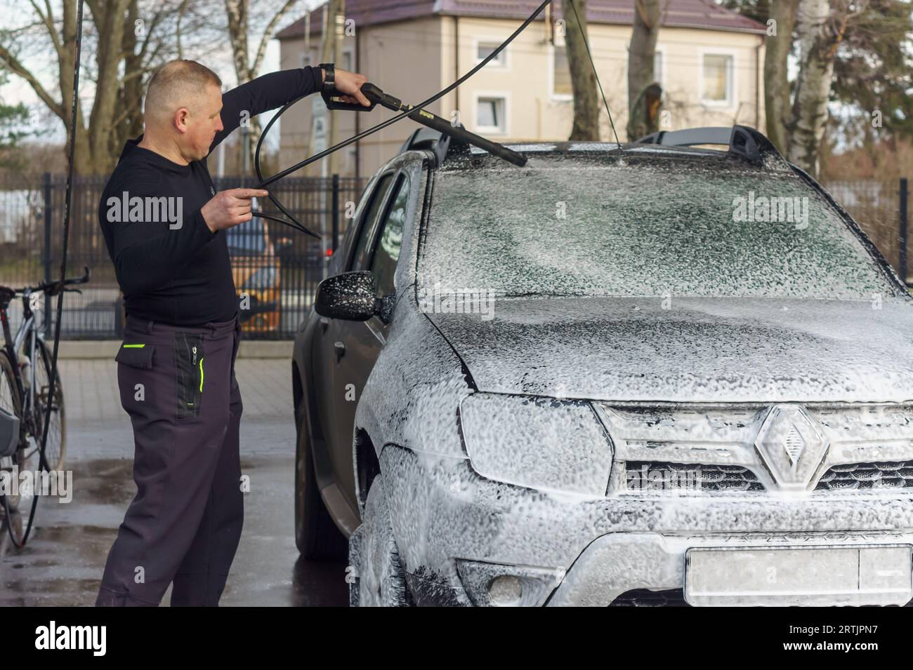 Kaliningrad, Russia, March 1, 2020. A man washes his car at a touchless ...