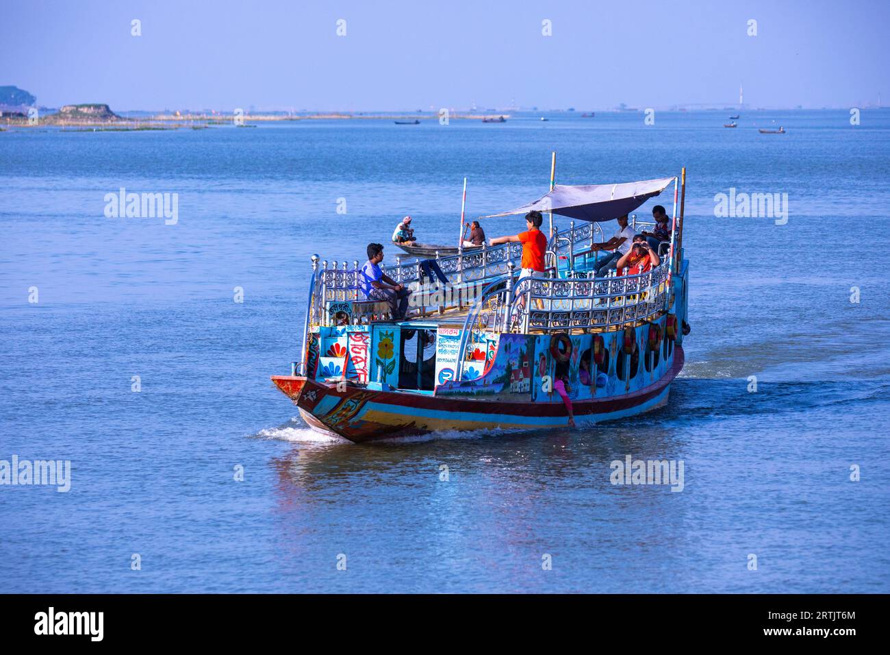 A passenger boat on the Nikli Haor at austagram in Kishorganj ...