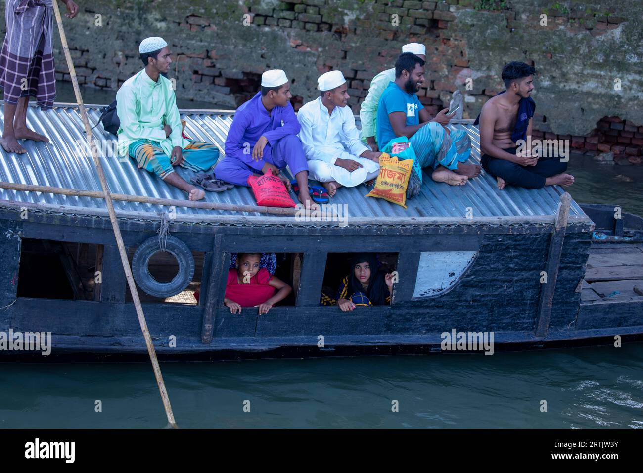 A passenger boat on the Nikli Haor at austagram in Kishorganj ...