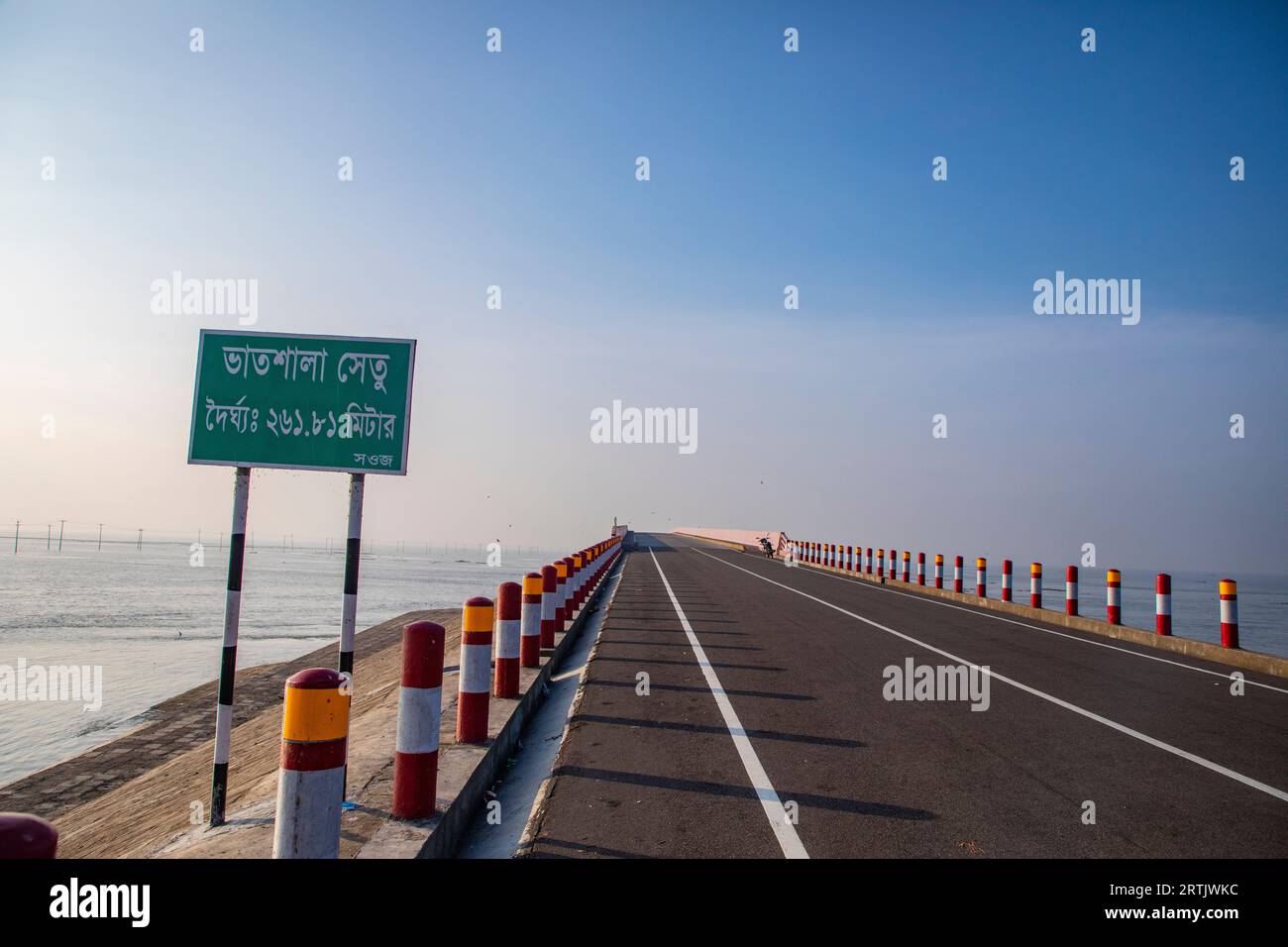 Itna-Mithamoin-Austagram all-weather road goes straight through a vast haor area in parallel ...
