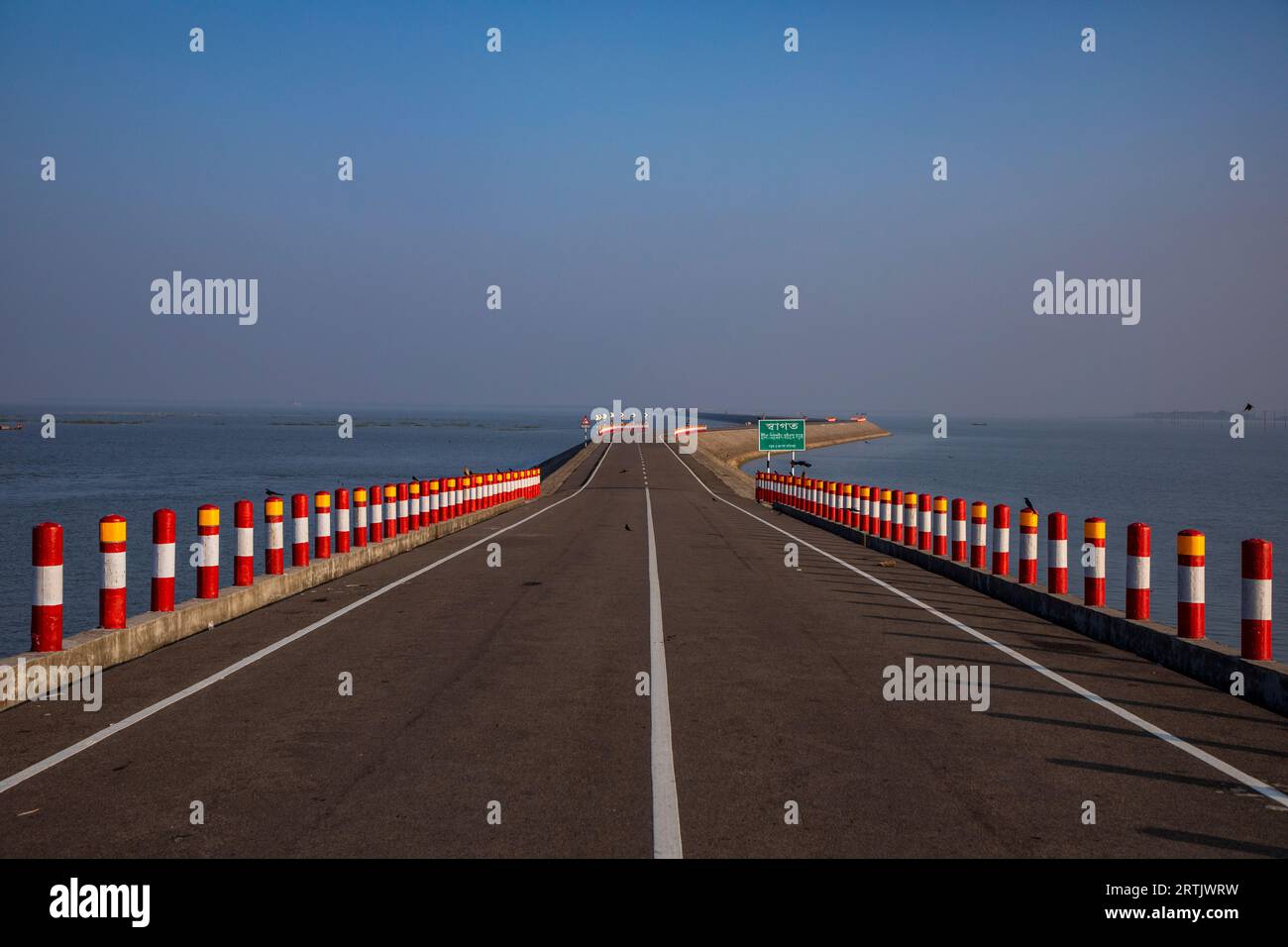 Itna-Mithamoin-Austagram all-weather road goes straight through a vast haor area in parallel ...