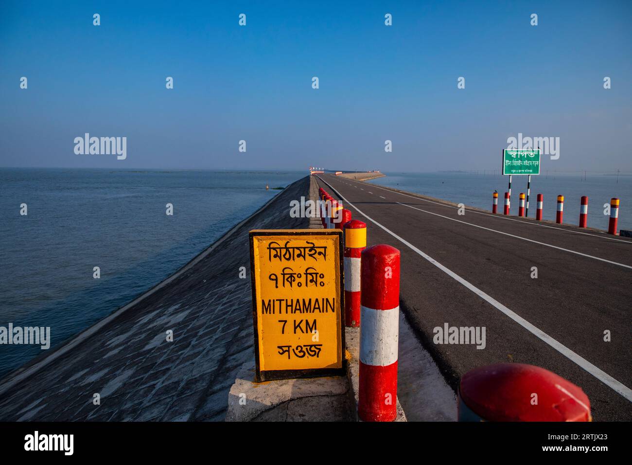 Itna-Mithamoin-Austagram all-weather road goes straight through a vast haor area in parallel ...