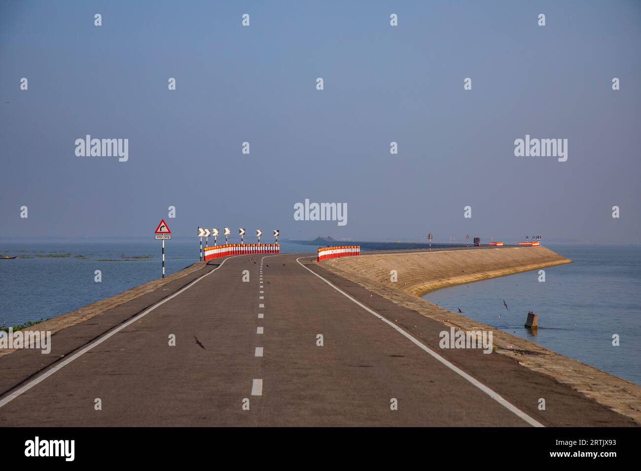 Itna-Mithamoin-Austagram all-weather road goes straight through a vast haor area in parallel ...