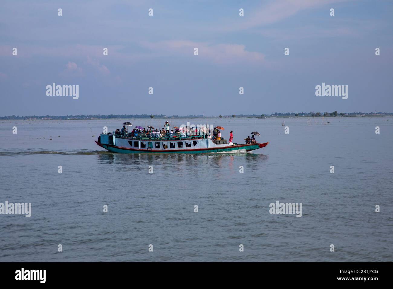 A passenger boat on the Nikli Haor at austagram in Kishorganj ...