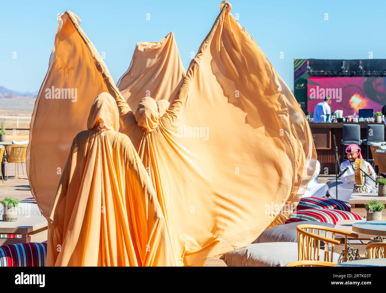 Saudi Arabian women in traditional fully covered golden clothes are ...
