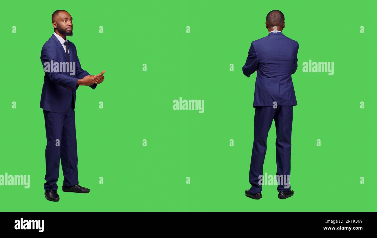 Young adult in suit having symphony concert at opera, conducting choir ...