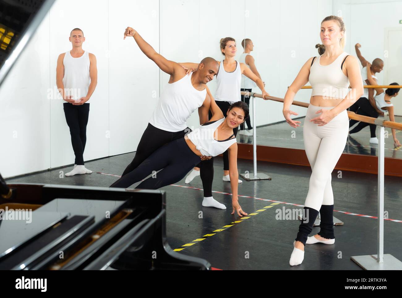 Ballet troupe performing dance in gum Stock Photo - Alamy